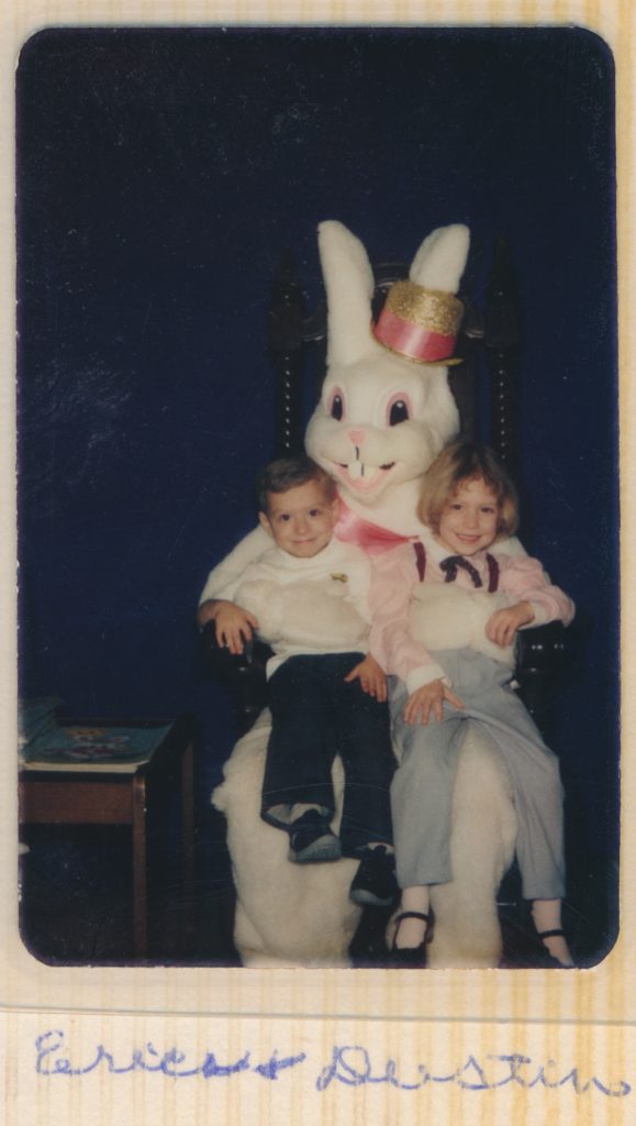 Erica and Dustin sitting on Easter bunny – Wilson Family Album