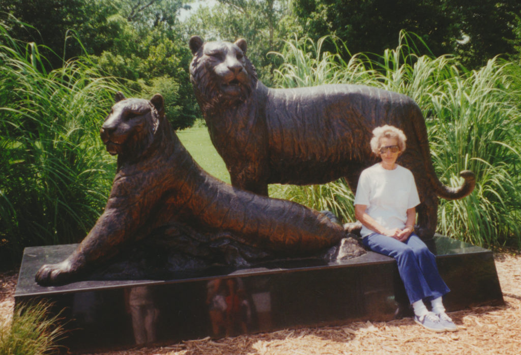 Ada with tiger statues – Wilson Family Album