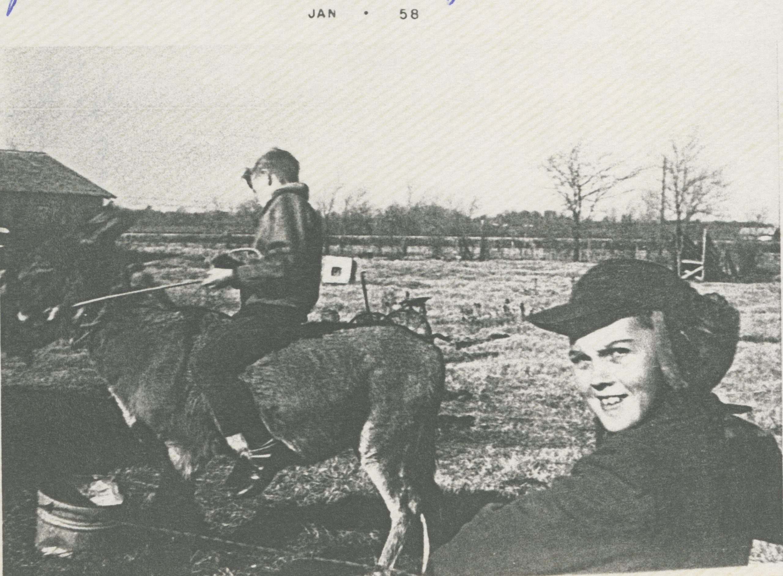 Jack riding Elvis (our donkey) and Freddie – Wilson Family Album