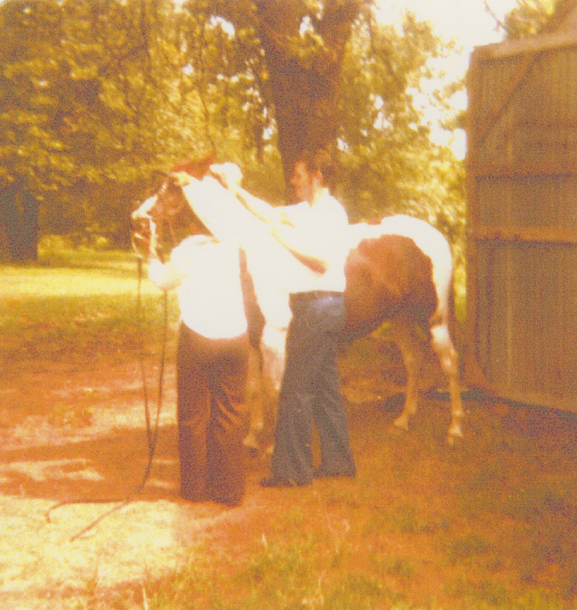 Erma and Emerson with horse at Erma’s – Wilson Family Album